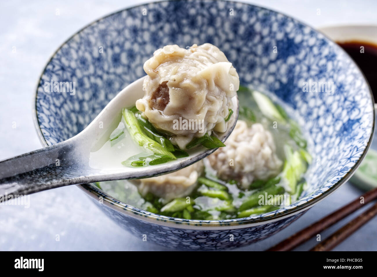 Traditional Chinese Wan Tan Soup as close-up in a bowl Stock Photo - Alamy