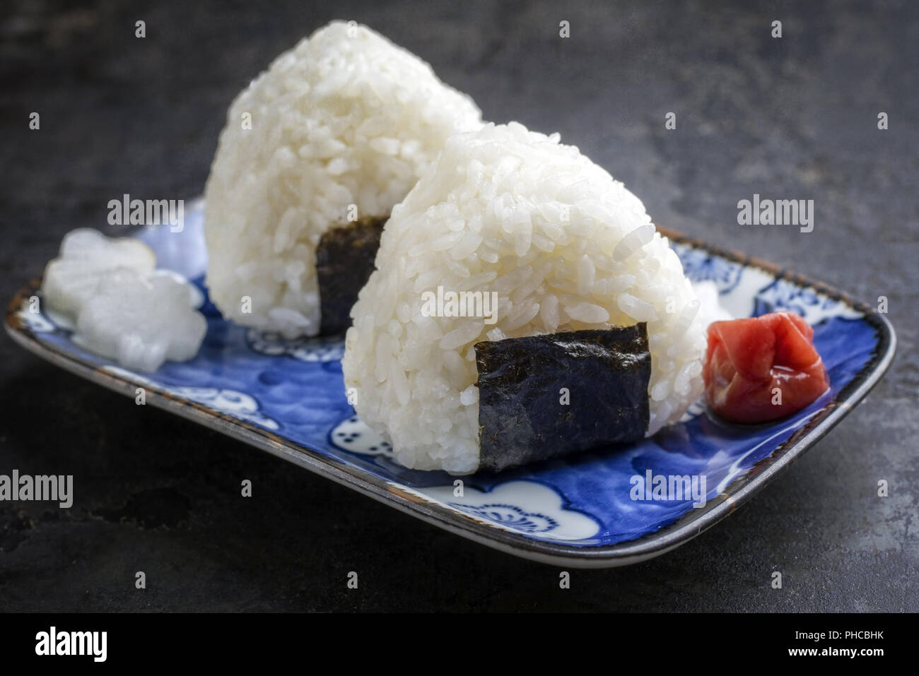Traditional Japanese Onigiri with Umeboshi as close-up on a bowl Stock ...