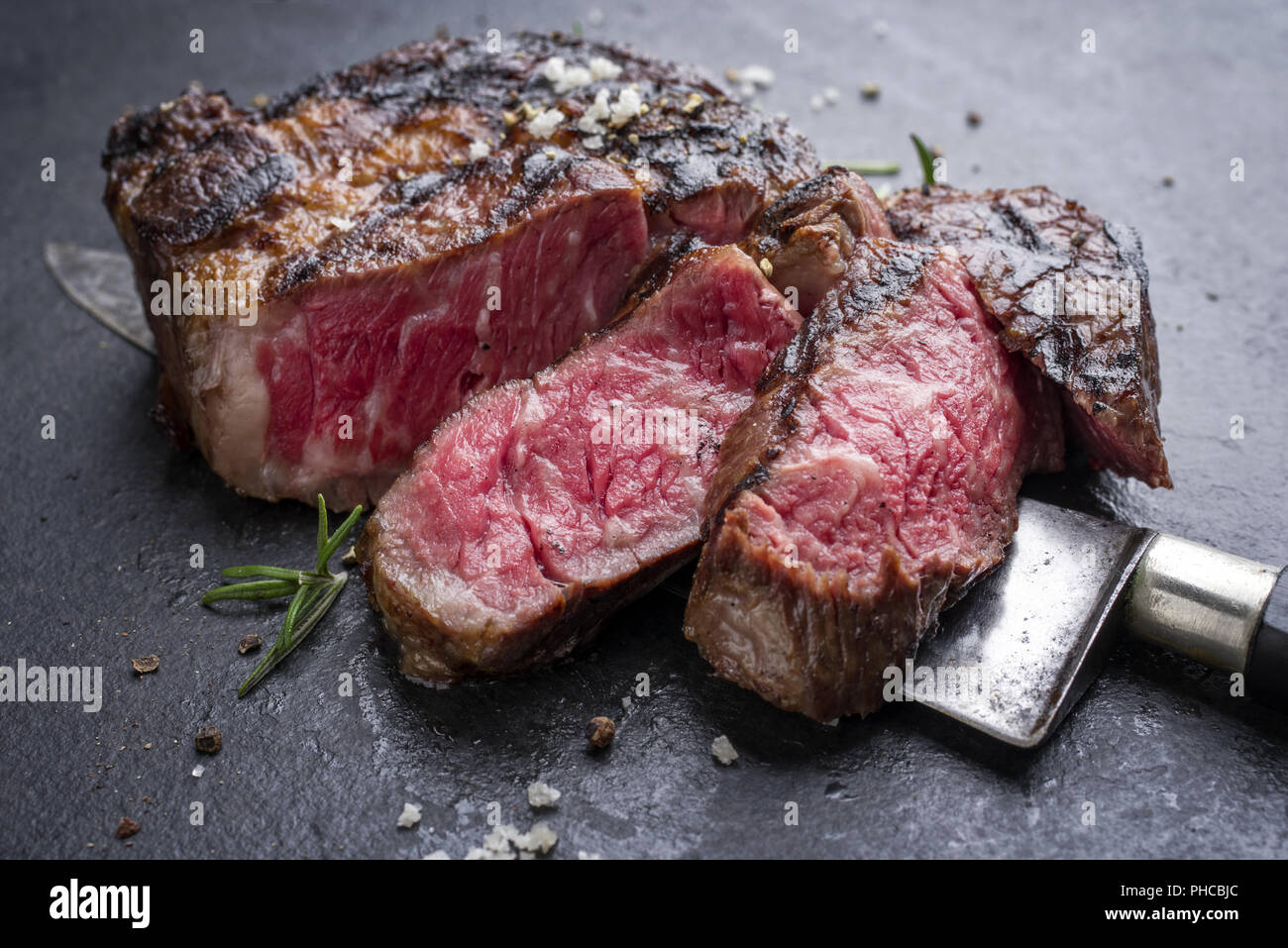 Barbecue aged Wagyu Rib Eye Steak as close-up on slate Stock Photo - Alamy