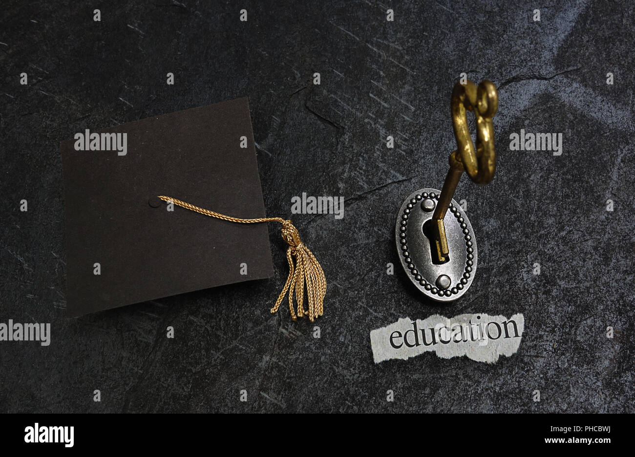 Gold education key Stock Photo - Alamy
