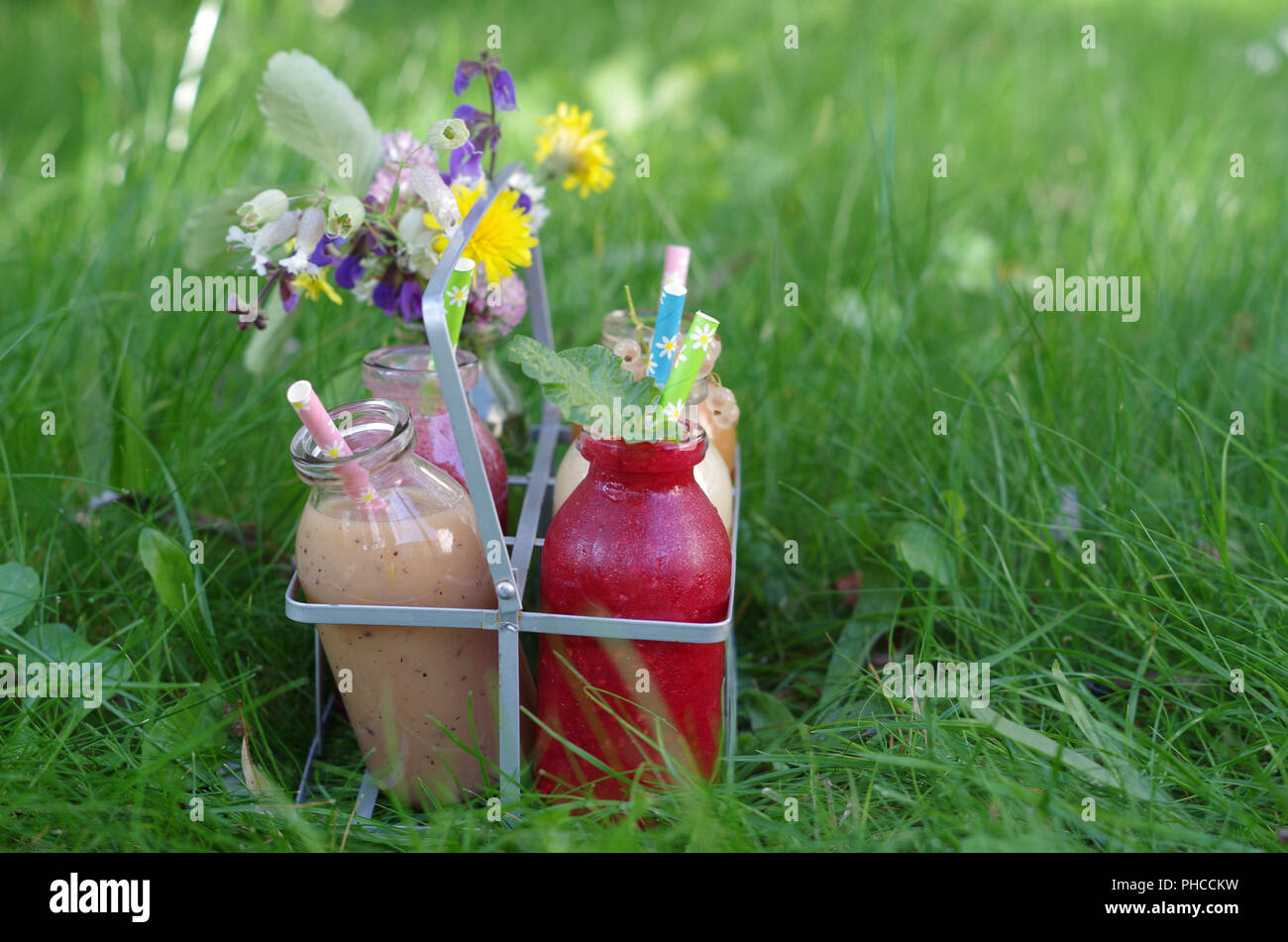 various fruit smoothies in flask Stock Photo - Alamy