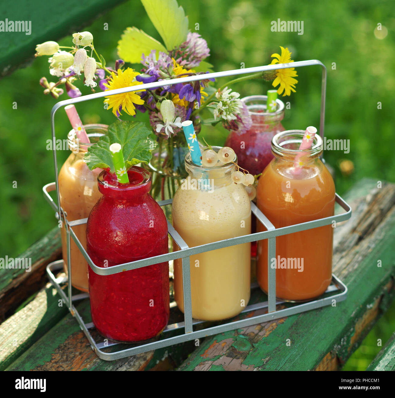 various fruit smoothies in flask Stock Photo - Alamy