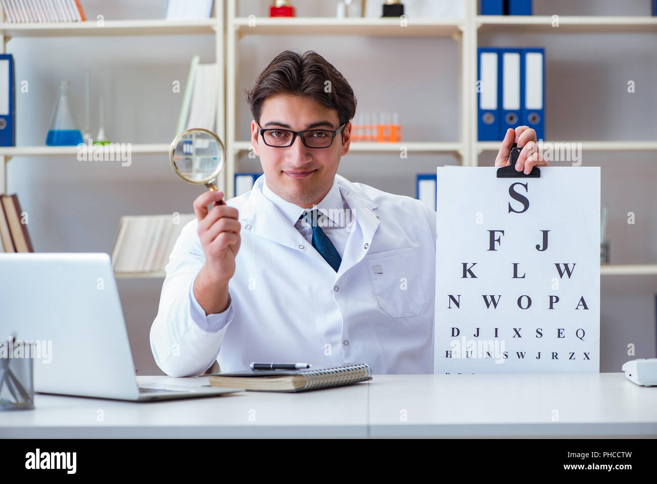 Doctor optician with letter chart conducting an eye test check Stock ...