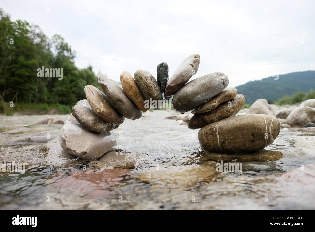 round stone bow in river Stock Photo - Alamy