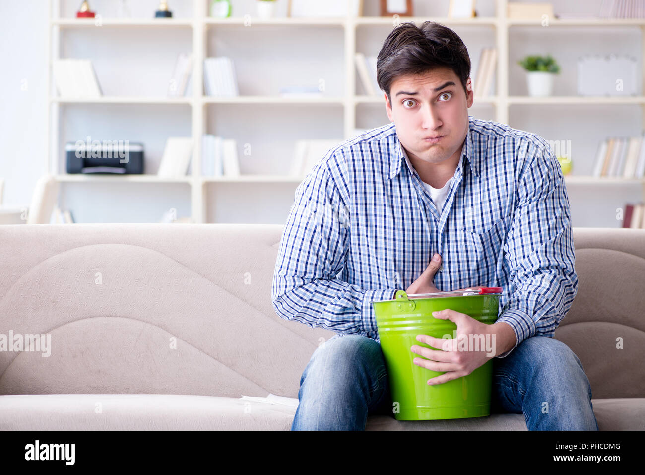 Man vomiting bucket hi-res stock photography and images - Alamy