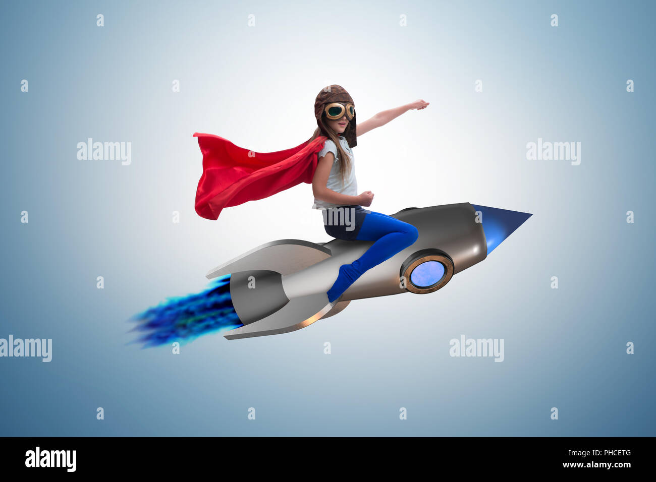 Little girl flying rocket in superhero concept Stock Photo - Alamy