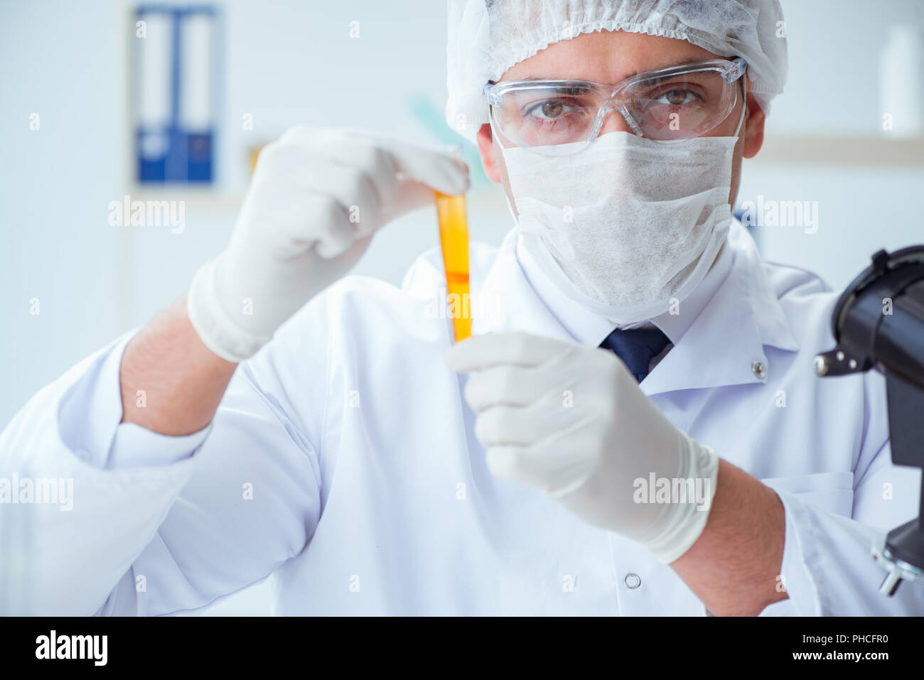 Doctor testing patients urine for medical purposes Stock Photo - Alamy