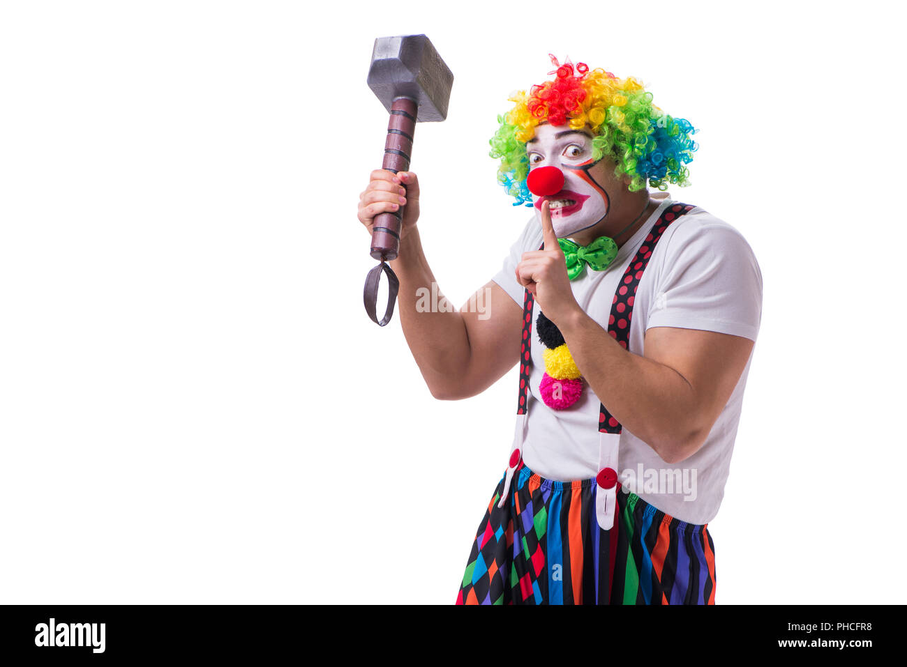 Funny clown with a hammer isolated on white background Stock Photo - Alamy