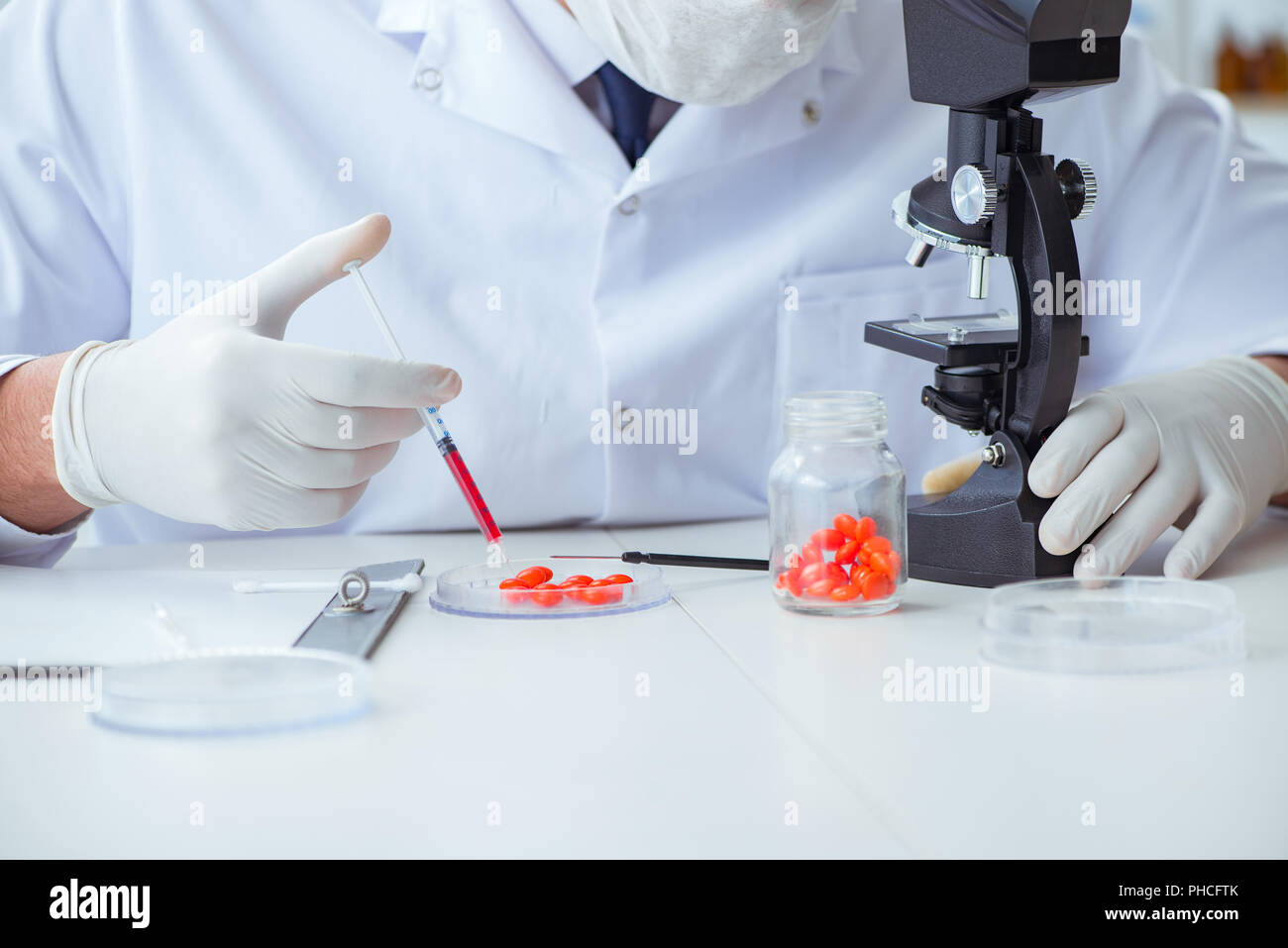 Doctor testing new drugs for medical purposes hi-res stock photography ...