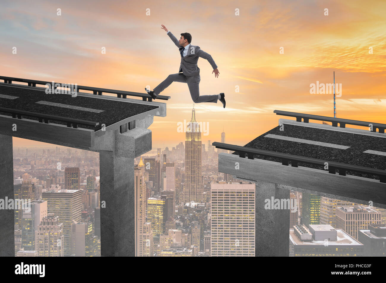 Young businessman jumping over the bridge Stock Photo - Alamy