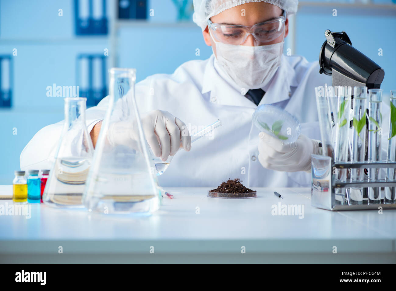 Male scientist researcher doing experiment in a laboratory Stock Photo ...