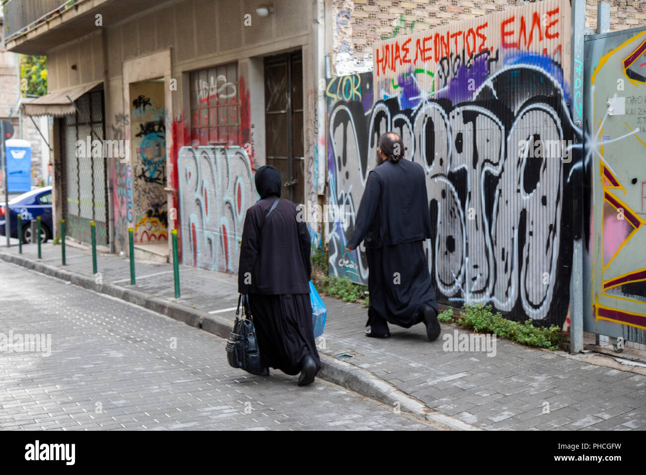 Traditional Greek Orthodox people Graffiti artwork on wall in Athens ...