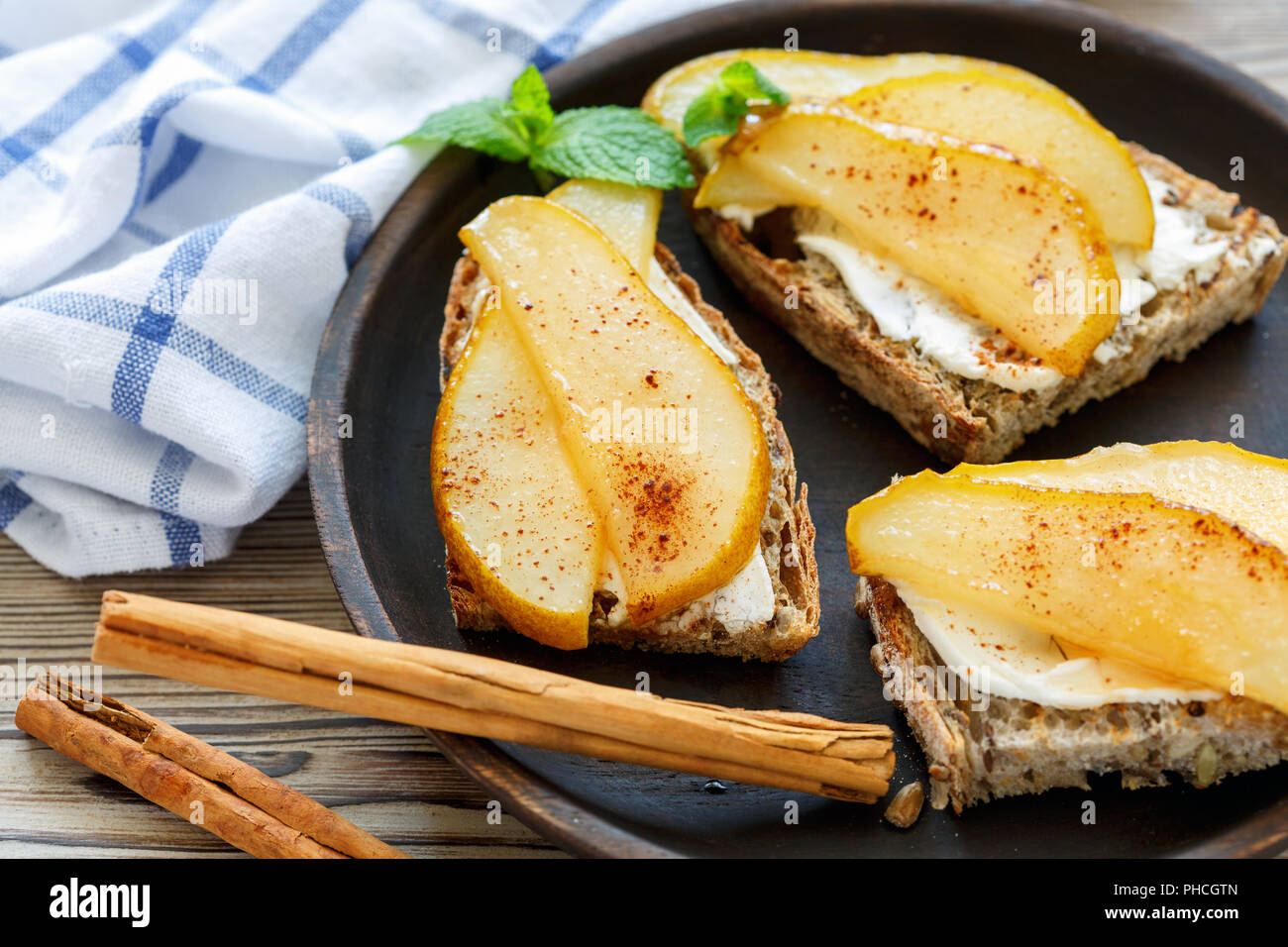 Homemade bread with ricotta, caramelized pears and cinnamon Stock Photo ...