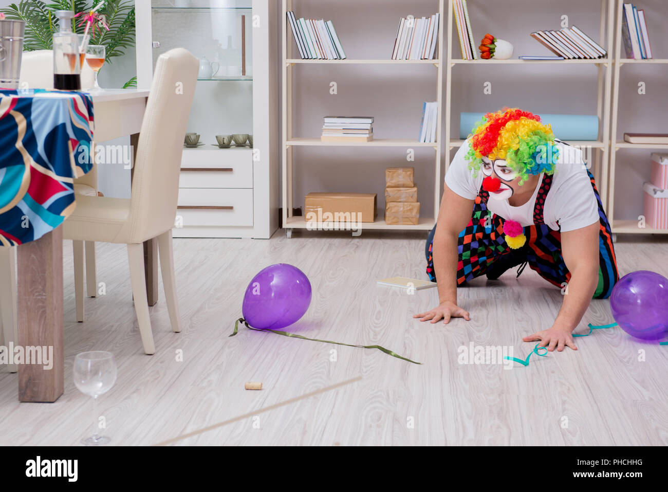 The drunk clown celebrating having a party at home Stock Photo - Alamy