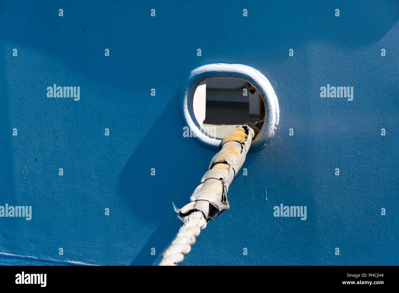 porthole of ship with rope Stock Photo - Alamy
