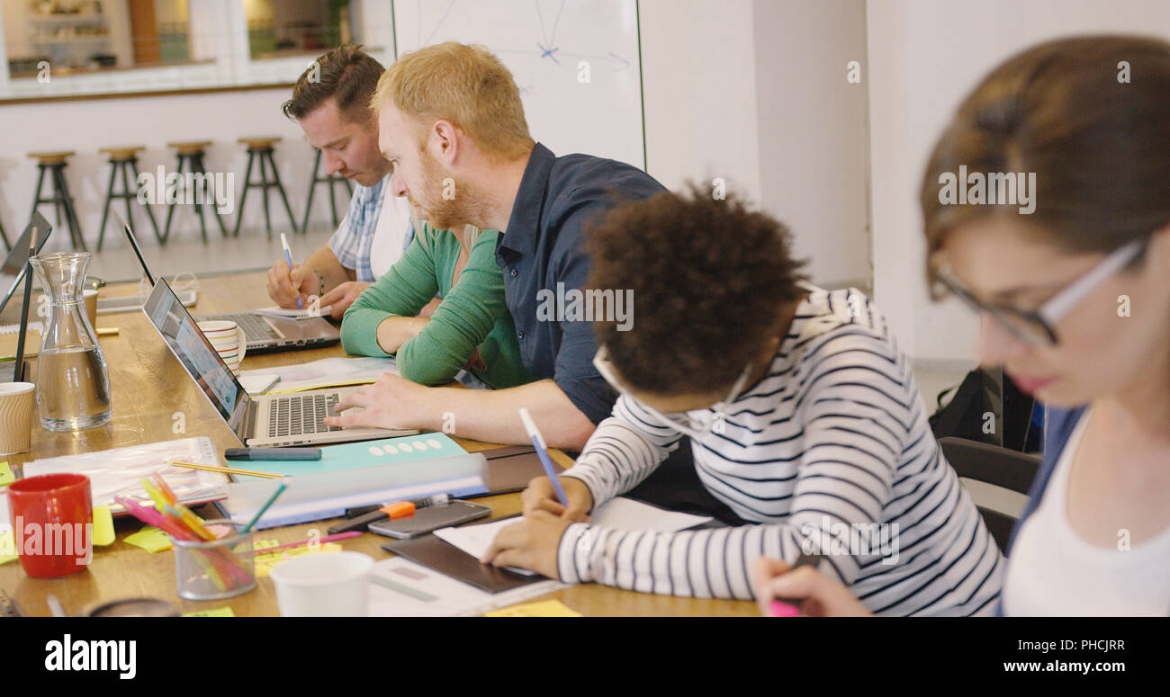 Group working on project hi-res stock photography and images - Alamy