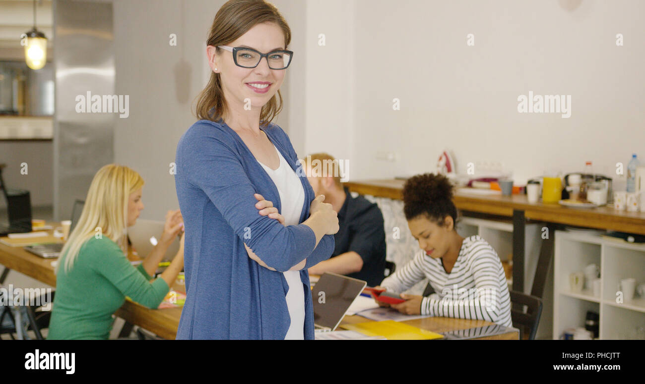 Confident woman posing in modern office Stock Photo - Alamy