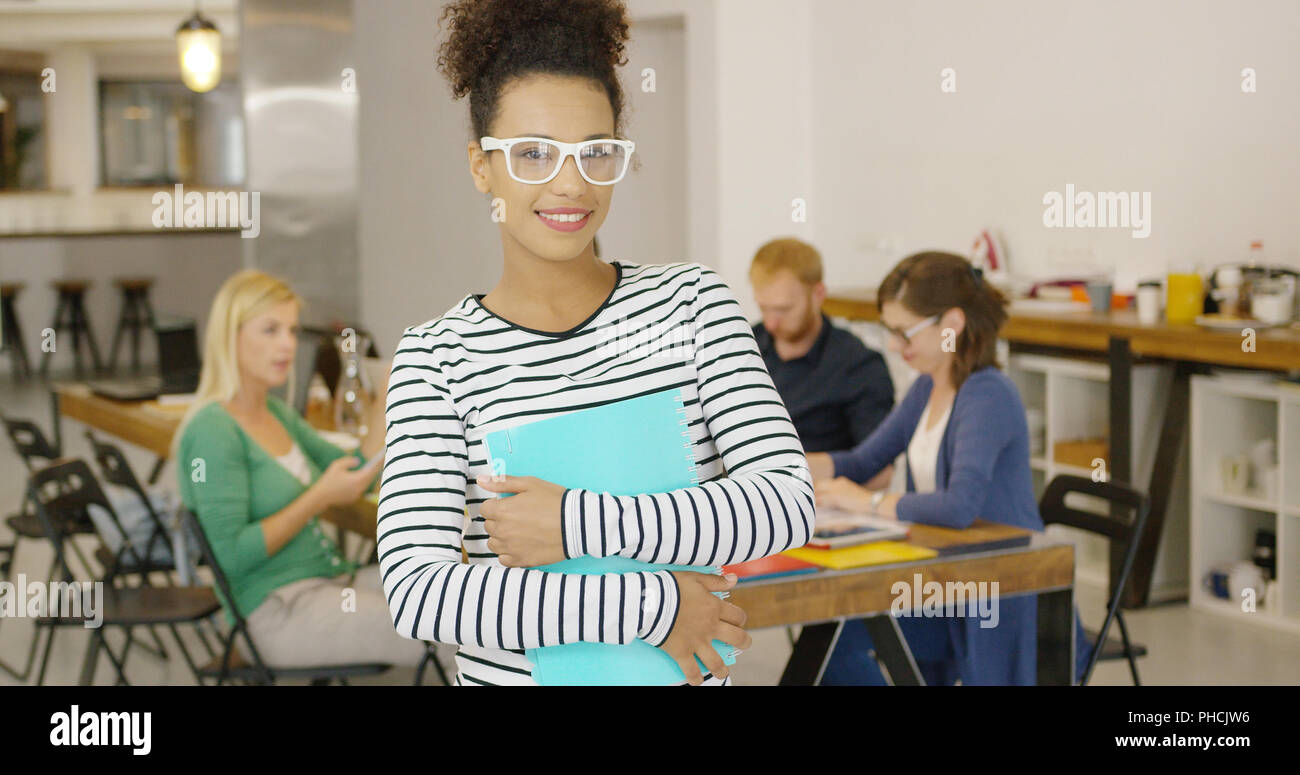 Content worker posing with notepad Stock Photo - Alamy