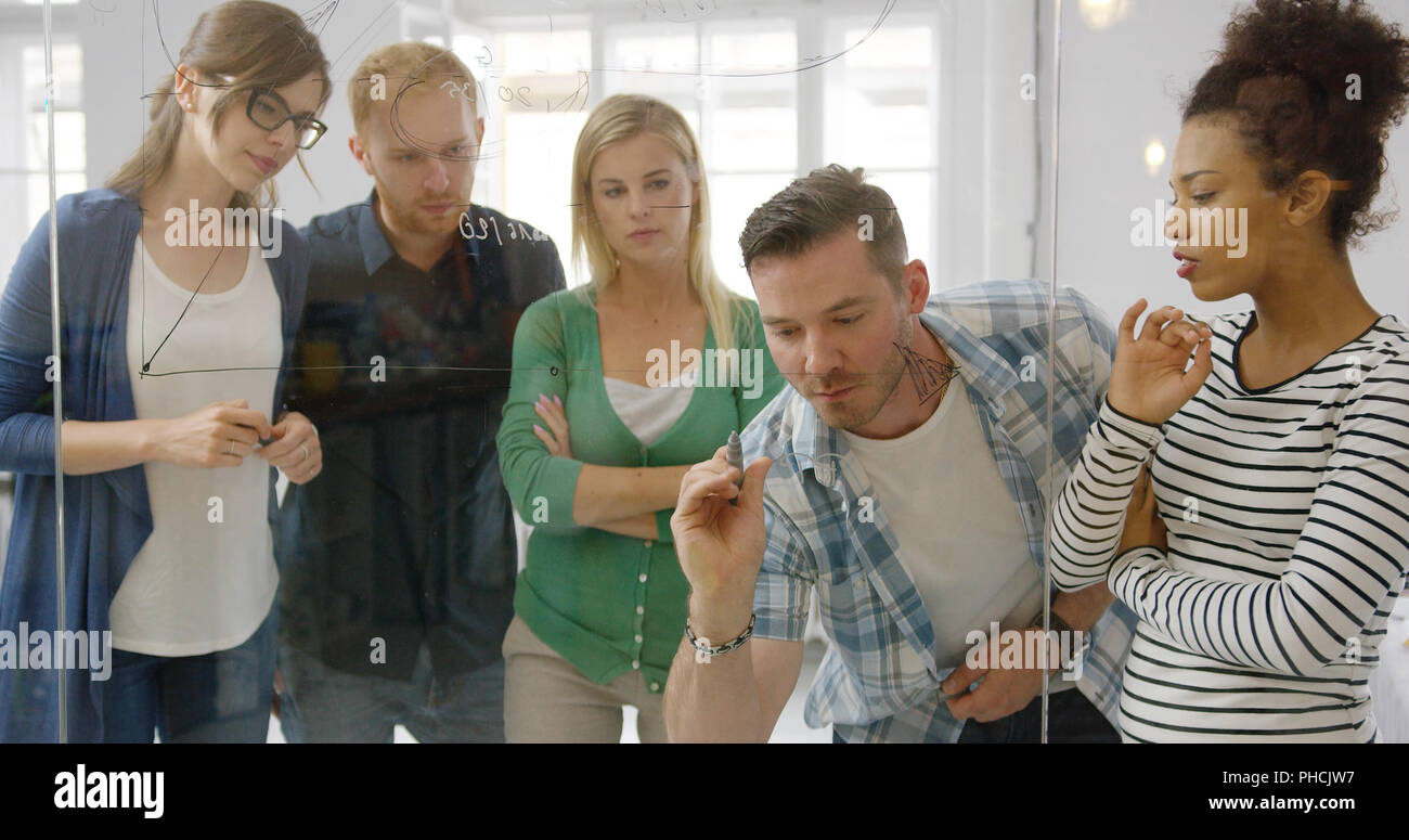 Interested colleagues taking part in work process Stock Photo - Alamy