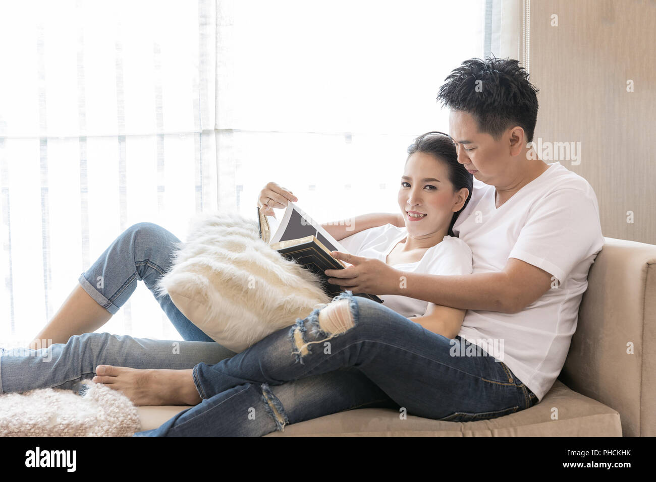 Young Couples reading book Stock Photo - Alamy