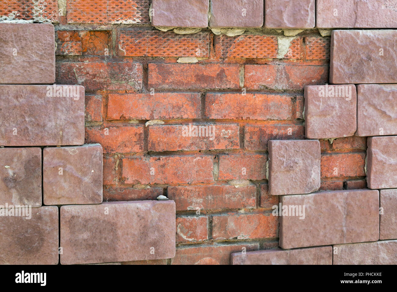 Poor-quality cement caused by the fall off of the facing tiles on the ...