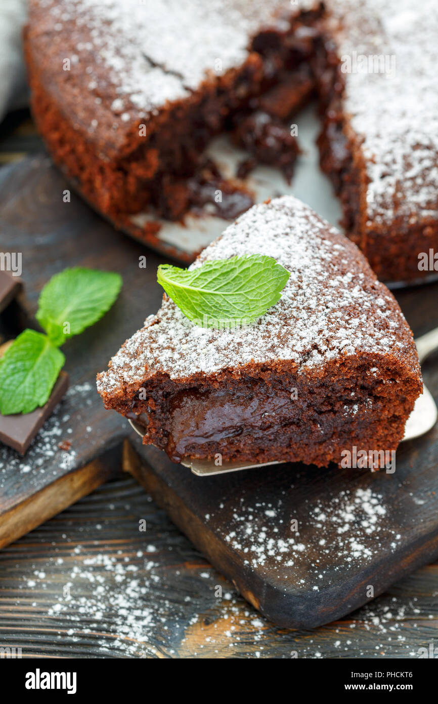 Piece of chocolate cake dusted with powdered sugar Stock Photo - Alamy