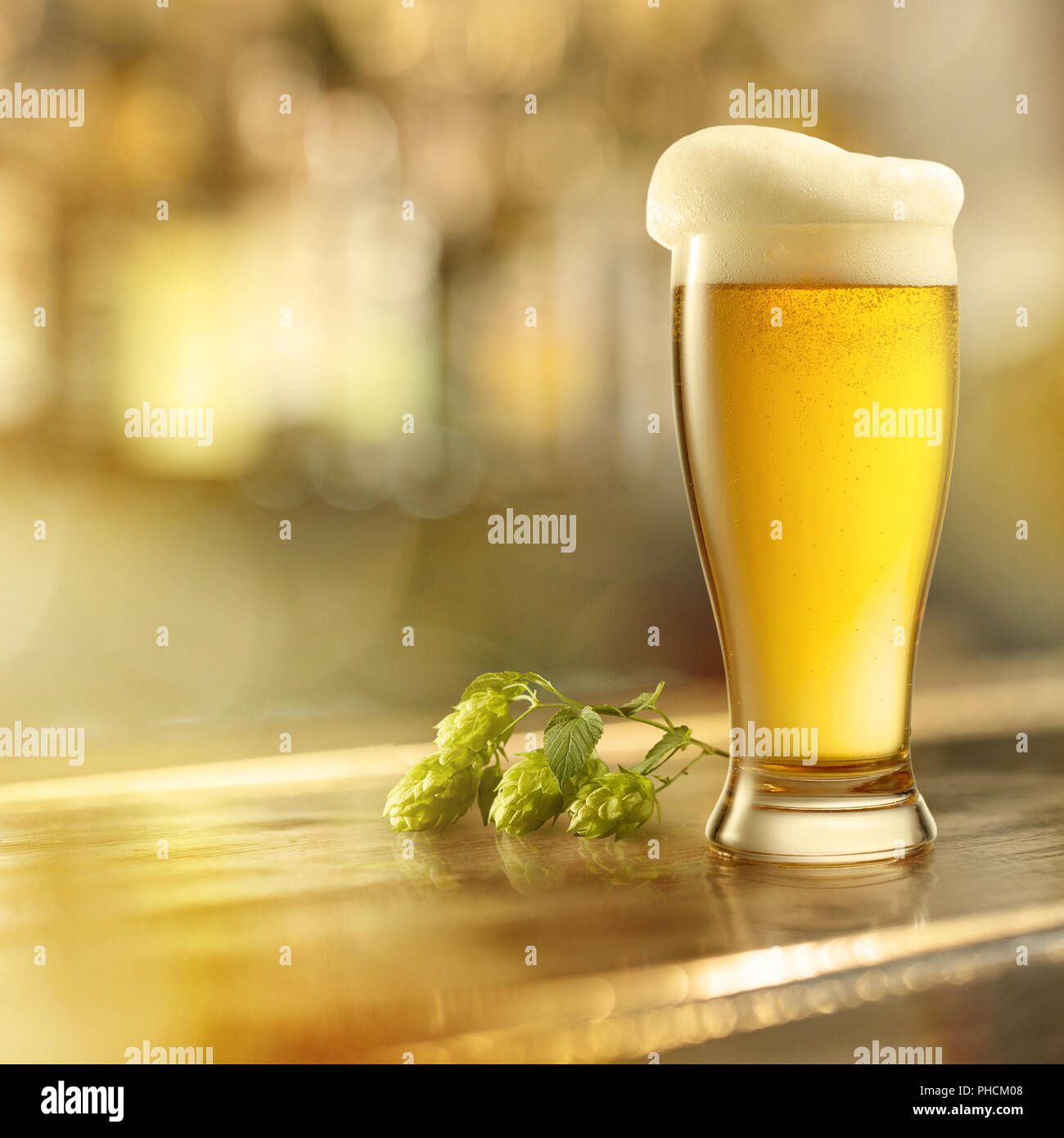 glass of beer with foam on the bar Stock Photo - Alamy