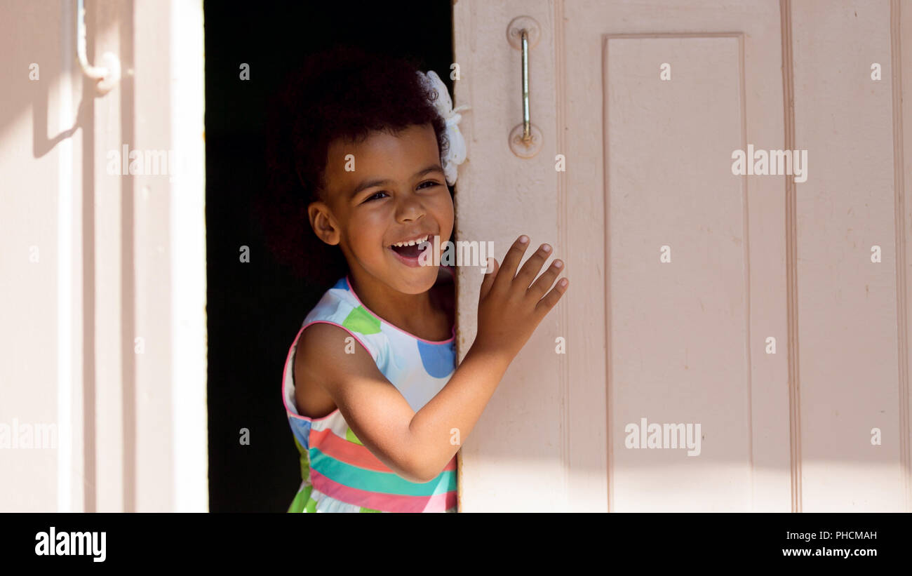 Child Holding Door Open