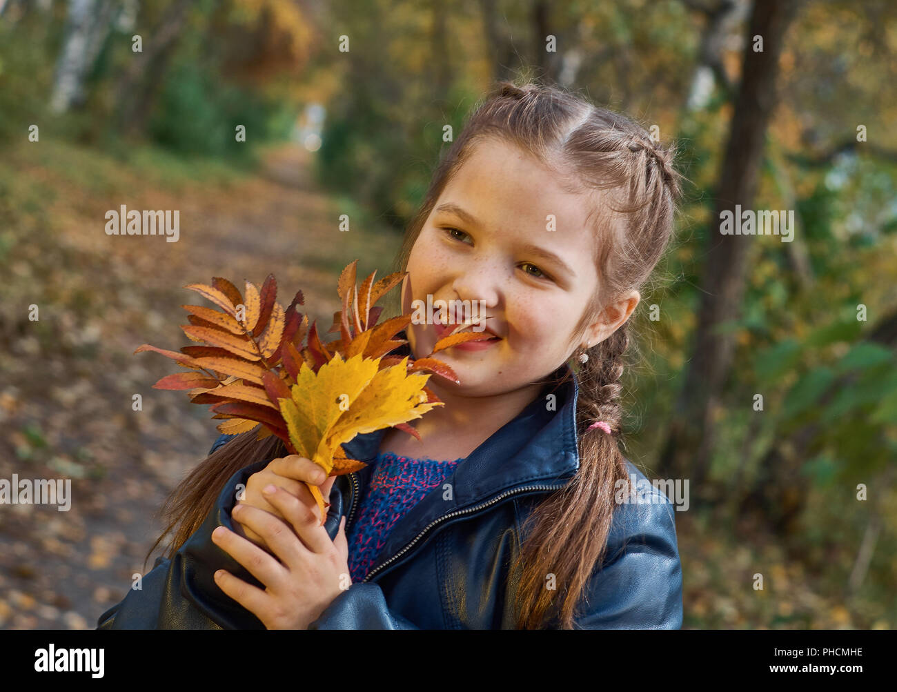 little girl having fun on beautiful autumn Stock Photo - Alamy