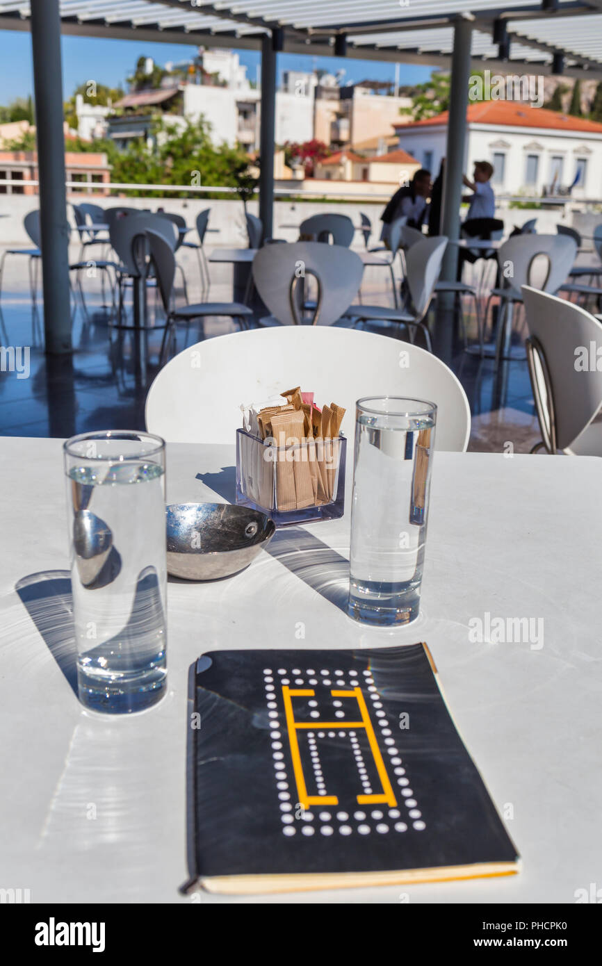 Table in street restaurant, Athens, Greece Stock Photo - Alamy
