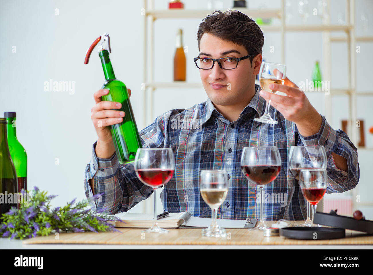 Professional sommelier tasting red wine Stock Photo - Alamy