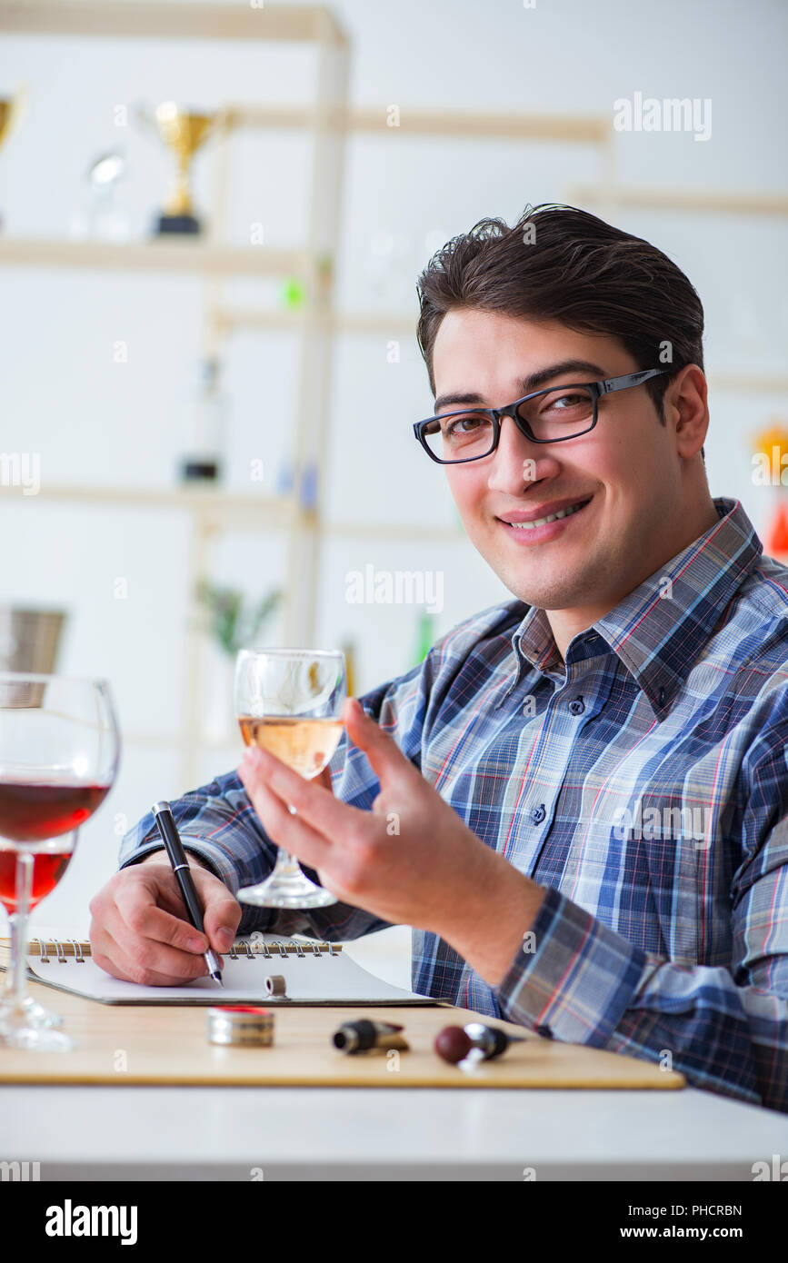 Professional sommelier tasting red wine Stock Photo - Alamy