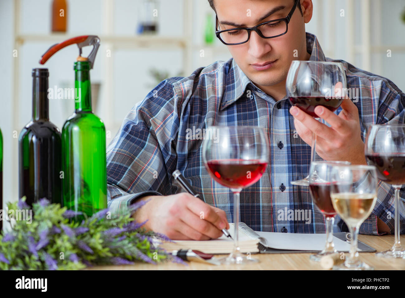 Professional sommelier tasting red wine Stock Photo - Alamy