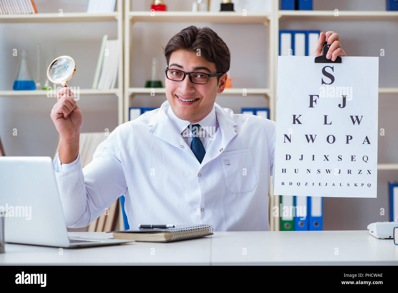 Doctor optician with letter chart conducting an eye test check Stock ...