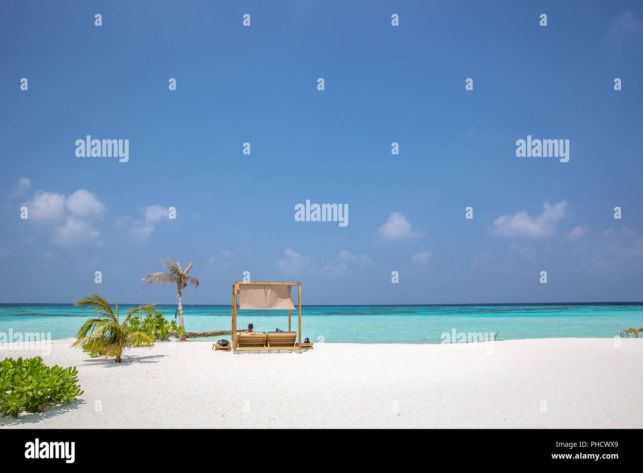 Amazing beach, yellow beach umbrella, blue sky, concept of paradise ...