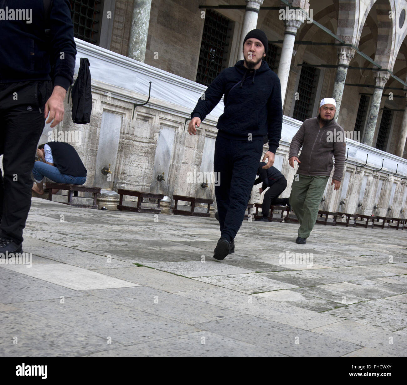 Moslim Men Wash Hands and Go to Pray at the Blue Mosque, Istanbul Stock ...