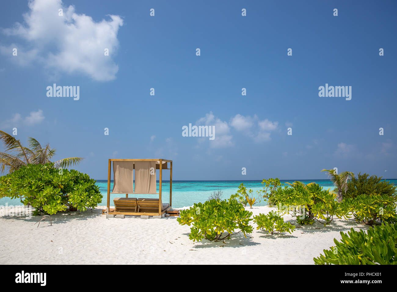 Amazing beach, yellow beach umbrella, blue sky, concept of paradise ...