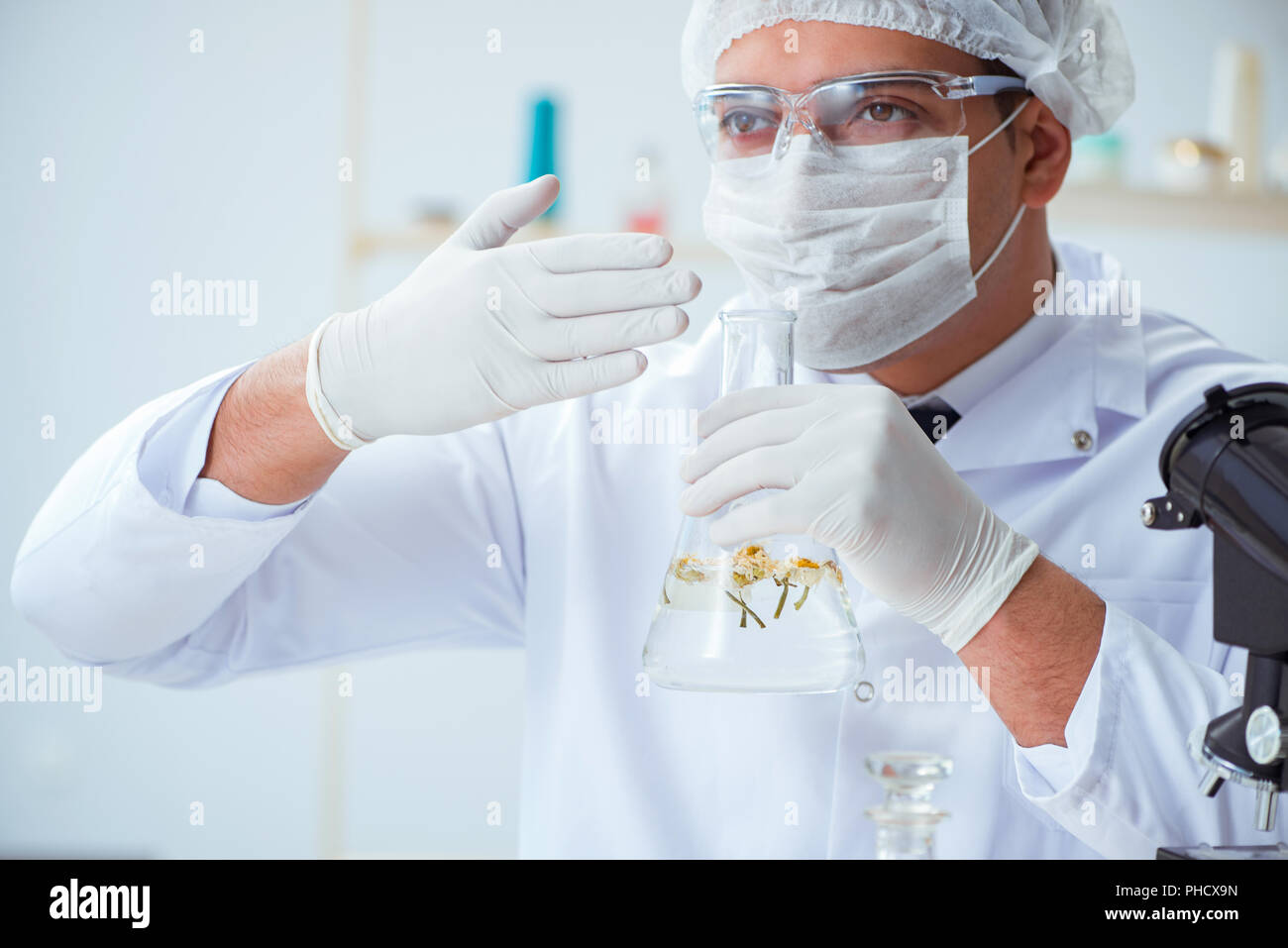 Chemist mixing perfumes in the lab Stock Photo - Alamy