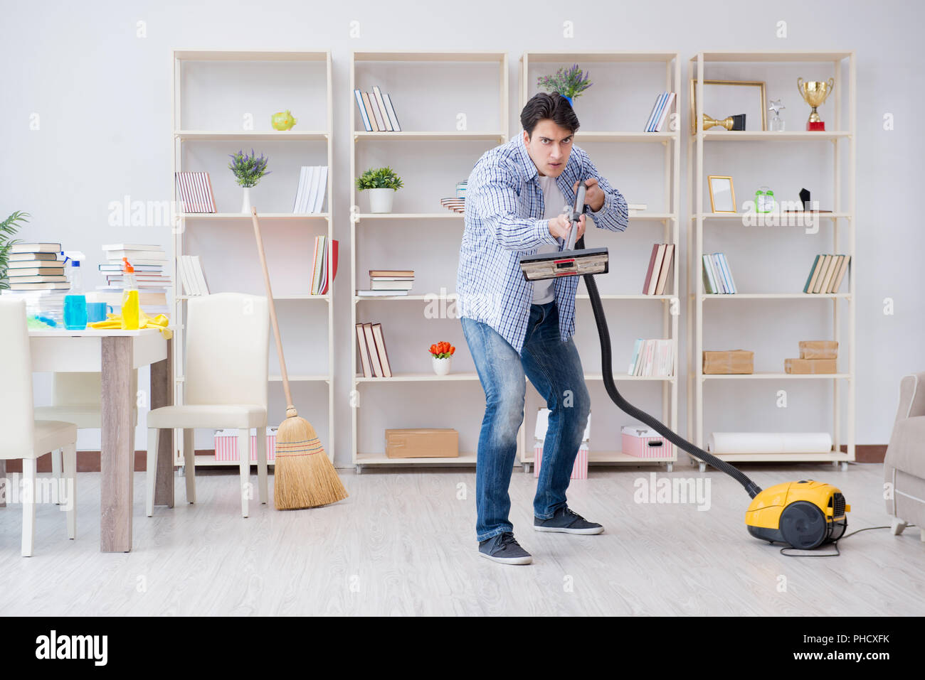 Man doing cleaning at home Stock Photo - Alamy