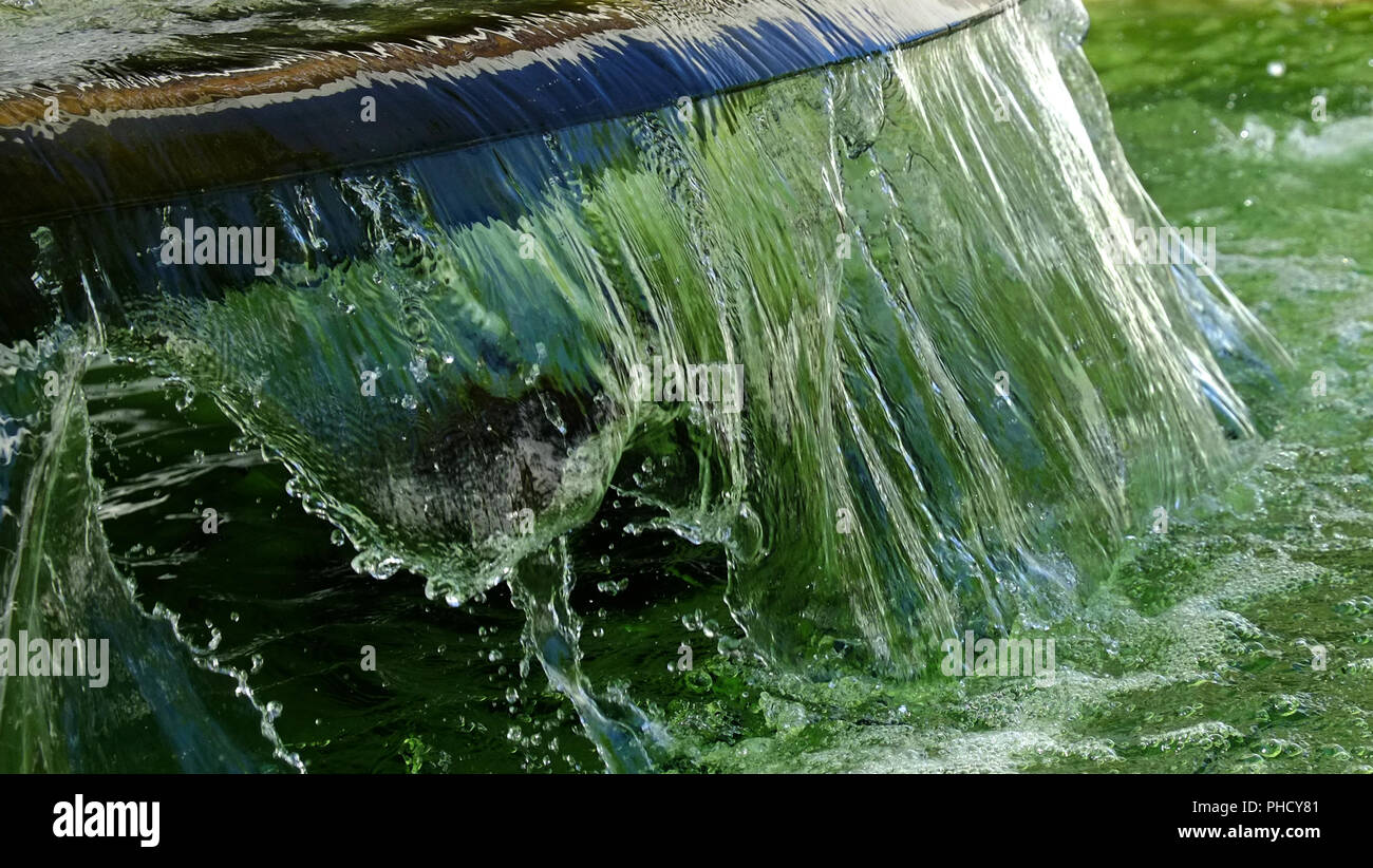 Fountain, flowing water Stock Photo - Alamy