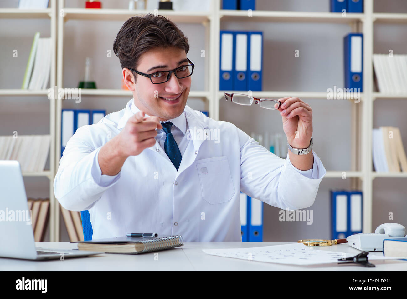Doctor optician prescribing glasses hi-res stock photography and images ...