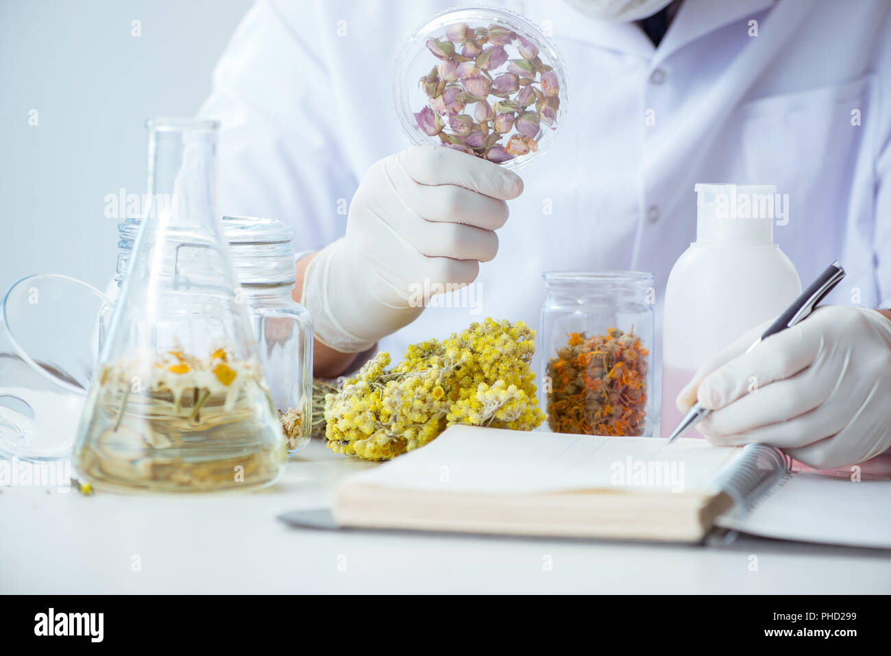 Chemist mixing perfumes in the lab Stock Photo - Alamy
