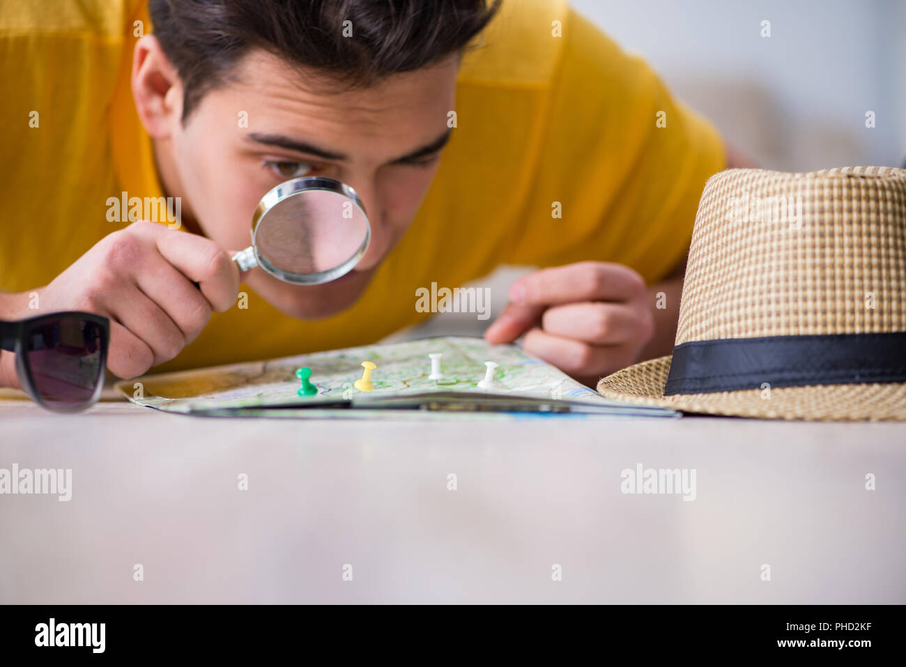 Man planning his vacation trip with map Stock Photo - Alamy