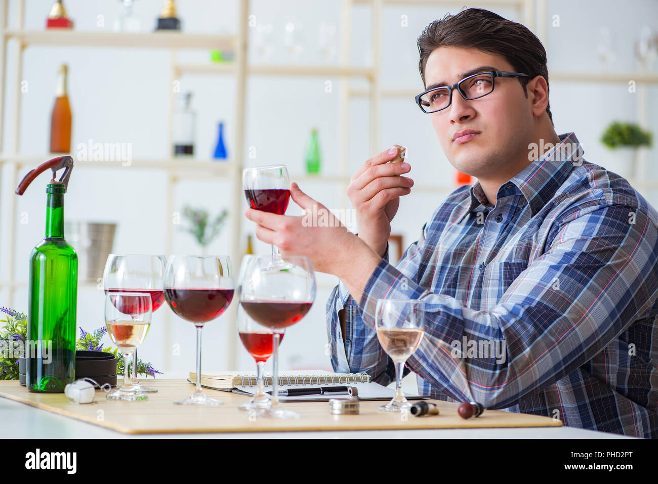Professional sommelier tasting red wine Stock Photo - Alamy