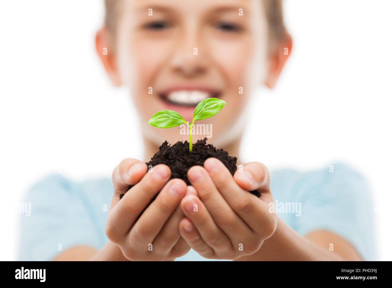 Handsome smiling child boy holding soil growing green sprout leaf Stock ...