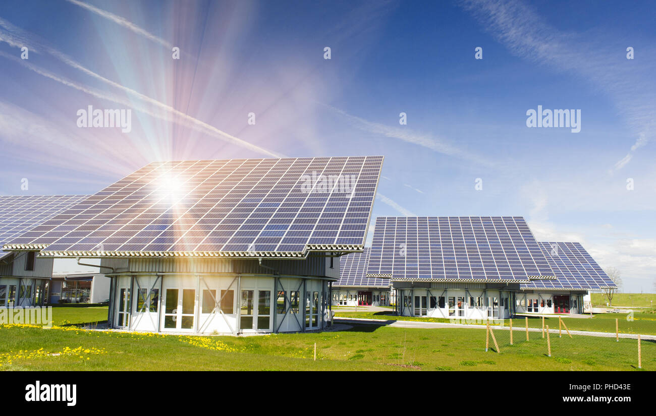 solar panels on roof with sun beams Stock Photo - Alamy