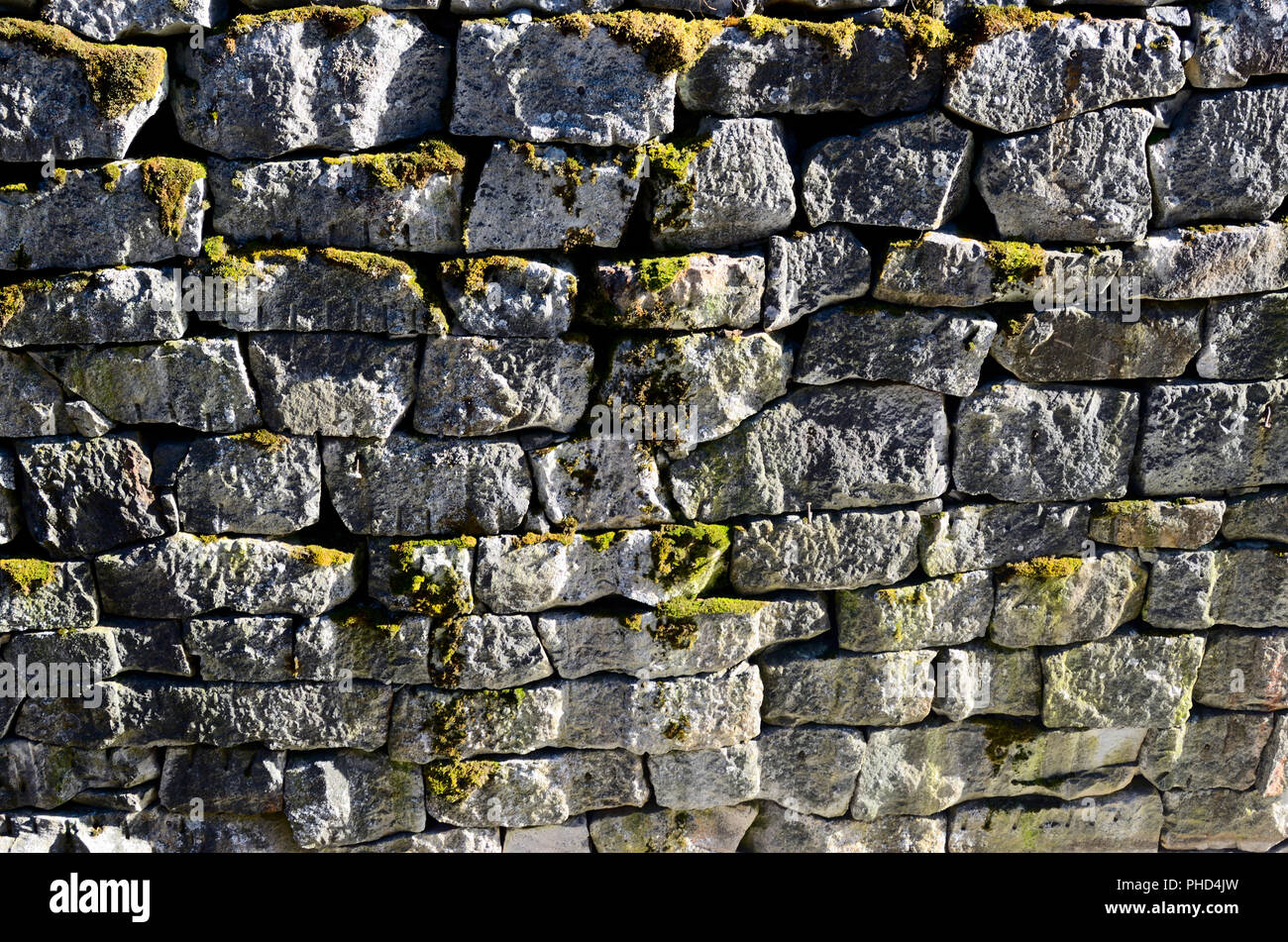 ancient granite stone wall channel mossy Stock Photo - Alamy