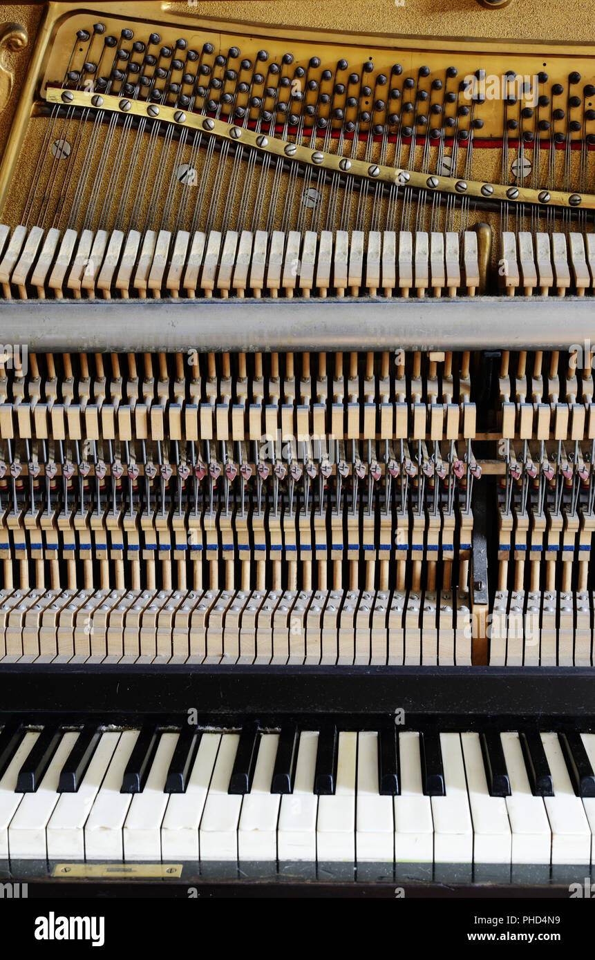 inside the piano: string, pins, keys Stock Photo - Alamy