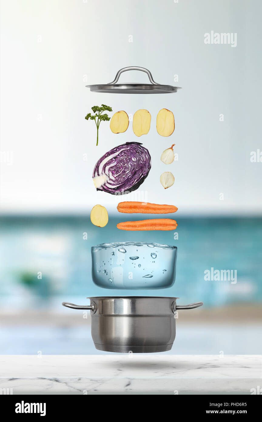 Fresh vegetables falling into stainless steel pot Stock Photo - Alamy