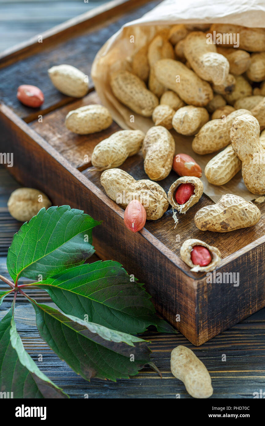 Paper bag with a dry peanut Stock Photo - Alamy